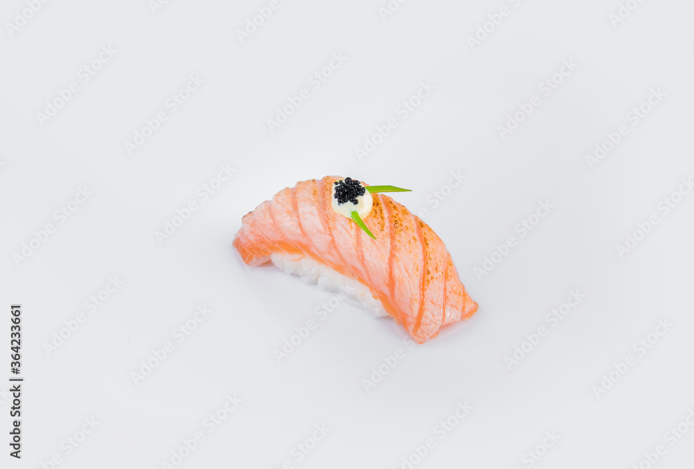 Nigiri sushi with salmon Tataki, rice, Japanese mayonnaise, flying fish ...