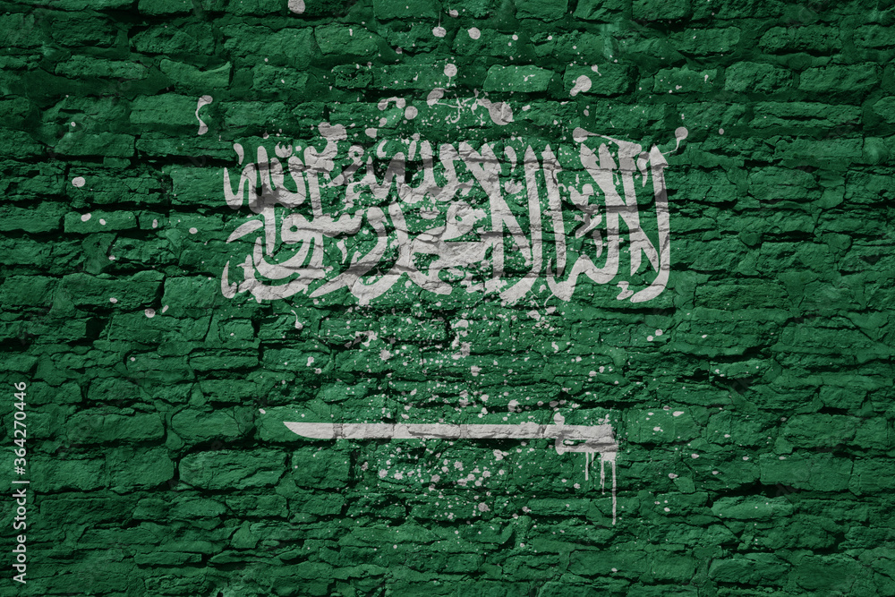 painted big national flag of saudi arabia on a massive old brick wall ...