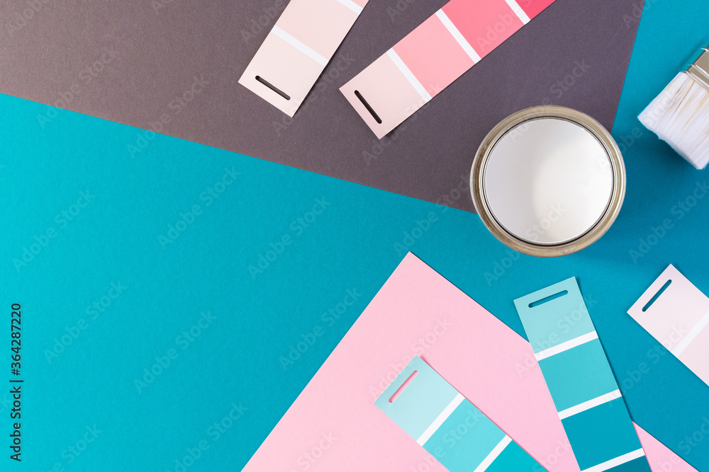 Can of white paint with brush on colorful background, selection of ...