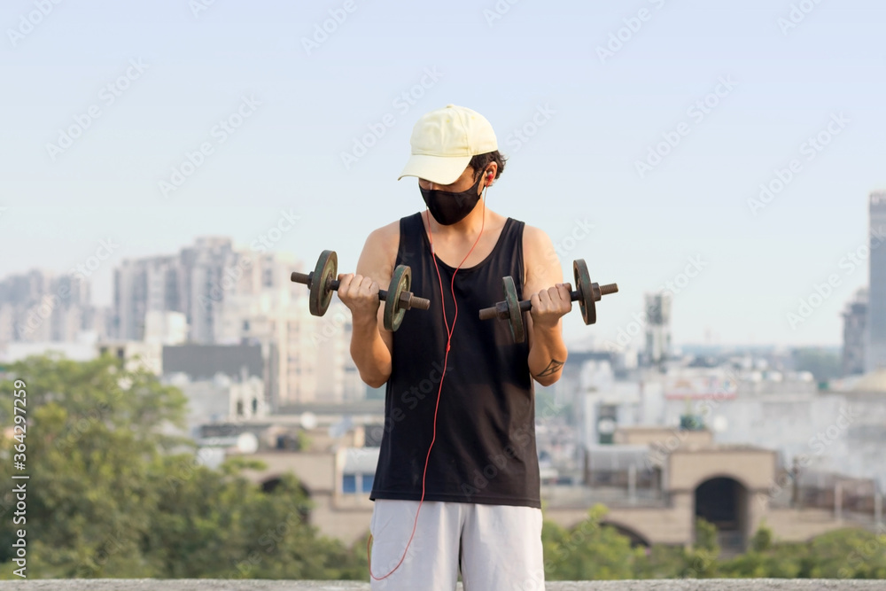 Young Man avoiding going to Gym to maintain Social Distancing and ...