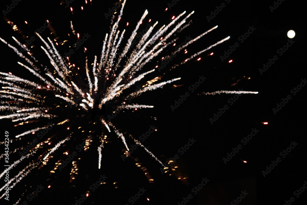 a close up single explosion of a spider rocket firework with a full ...