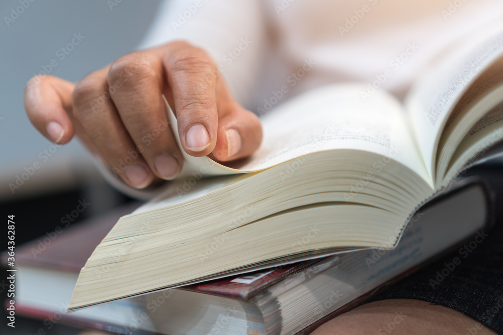 Reading book, opening books for education learning in textbook ...
