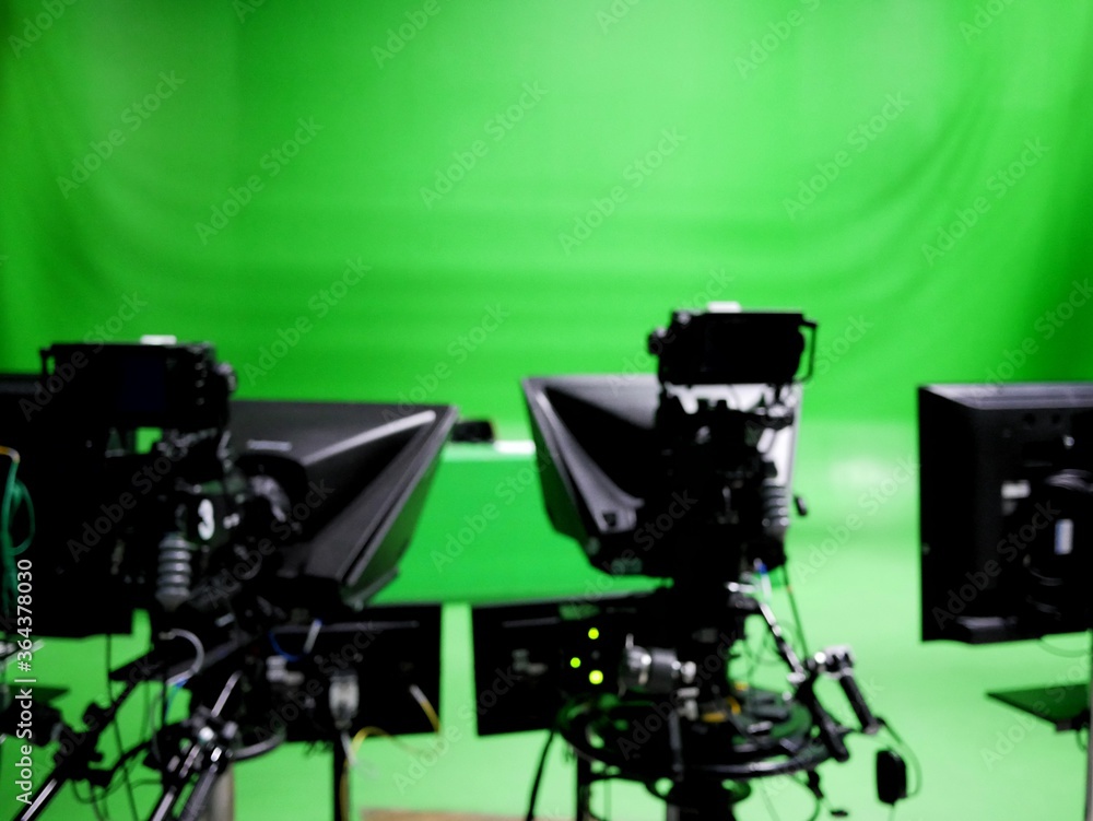 abstract blurred of broadcast camera in studio with greenscreen at TV ...