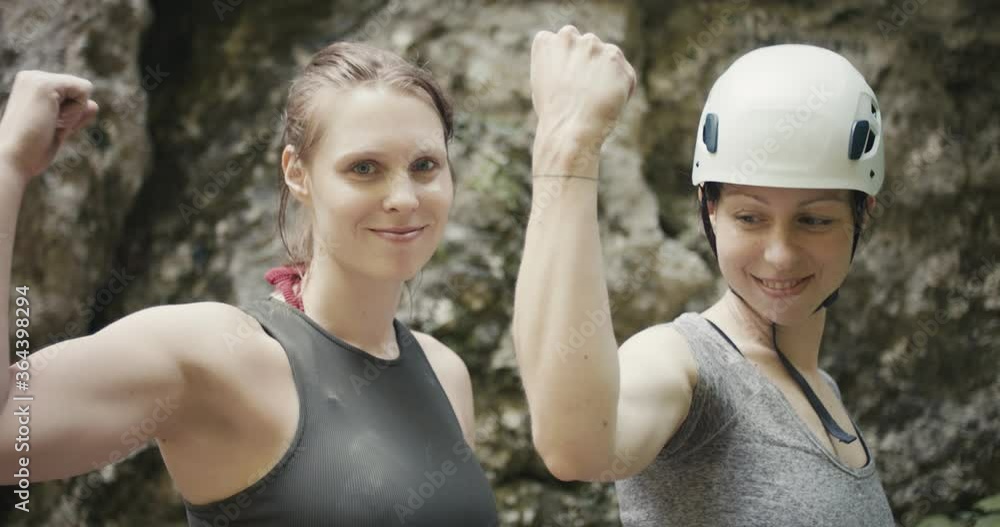 Video „Portrait of female climber woman friends flexing biceps muscle ...