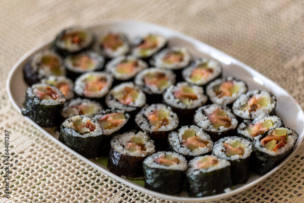 Top view of stack of Japanese sushi maki roll plate. Served in Japanese ...