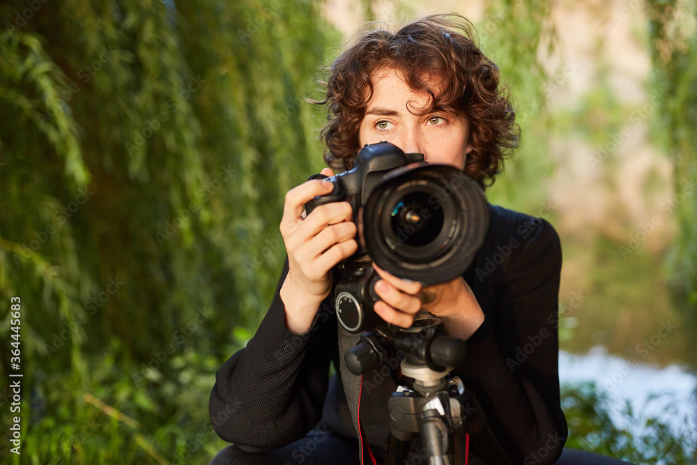 Woman as nature photographer with digital camera Stock Photo | Adobe Stock