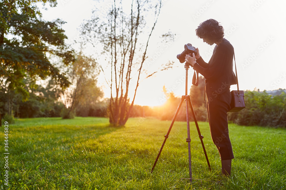 Woman with camera on tripod as nature photographer Stock Photo | Adobe ...