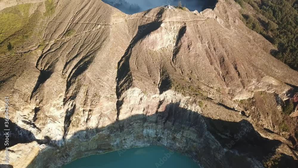 A drone capture of an early morning over the Kelimutu Lakes on Flores ...