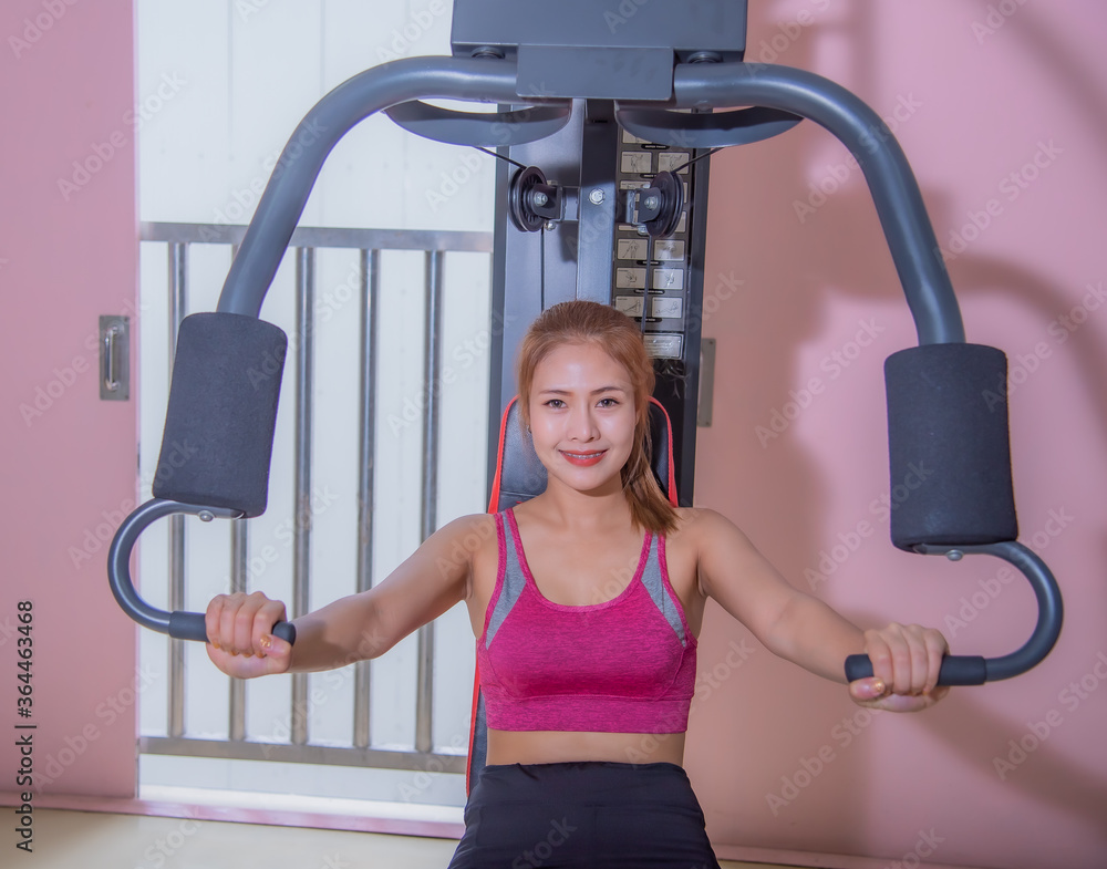 Young woman workout in gym healthy lifestyle.. Young women play sports ...