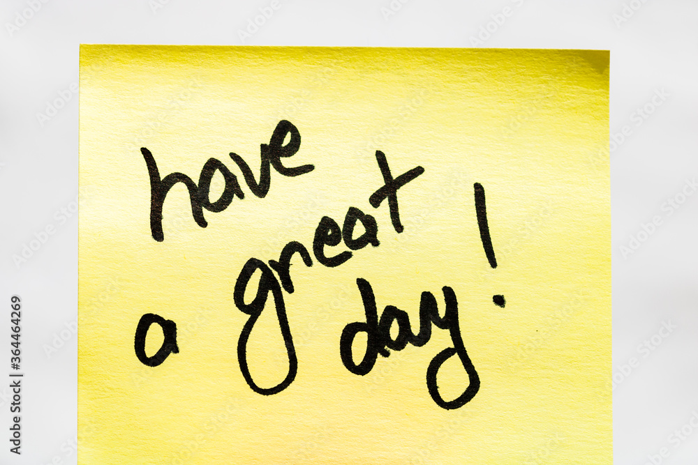 Have a great day handwriting text close up isolated on yellow paper ...