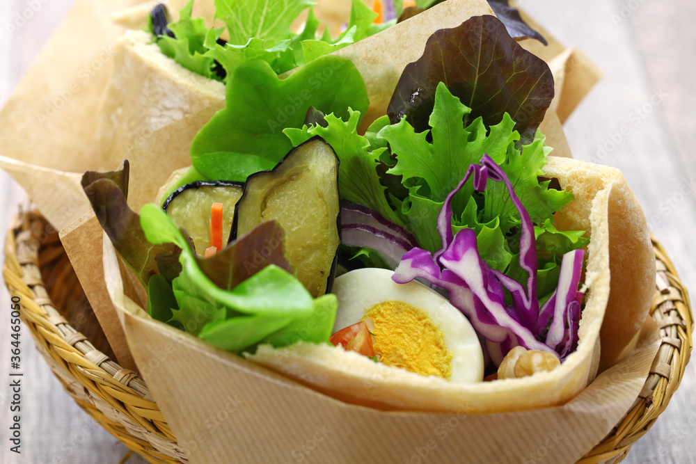 sabich: israeli pita sandwich with fried eggplant, hard boiled egg ...