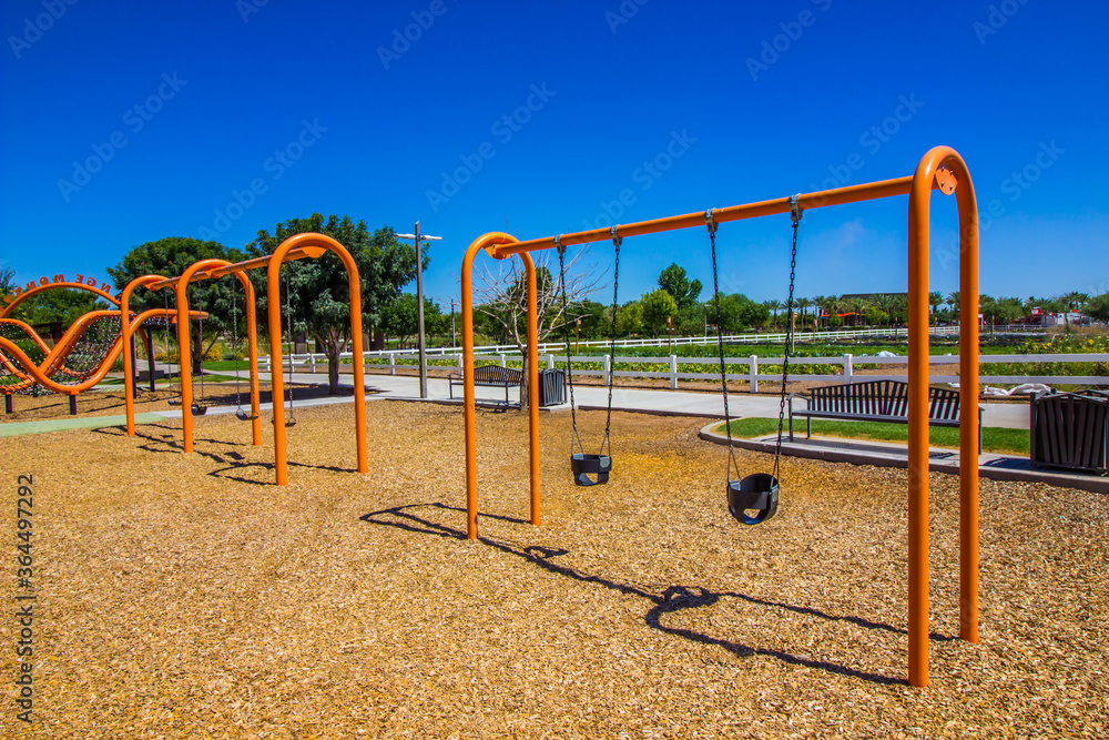 Bright Orange Swing Sets At Public Park Stock Photo | Adobe Stock