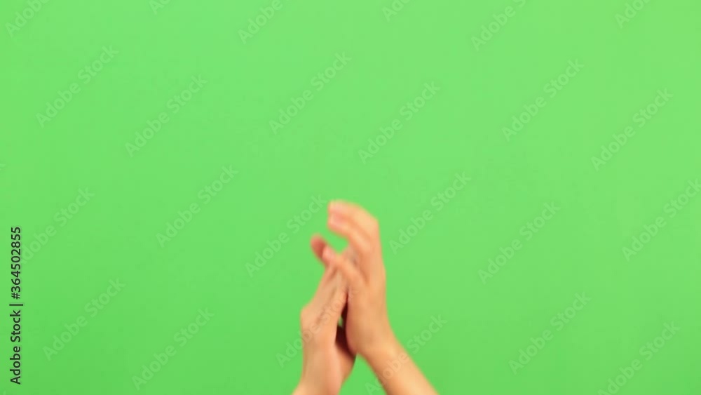 Hands are clapping on green screen background. Female hands clapping on ...