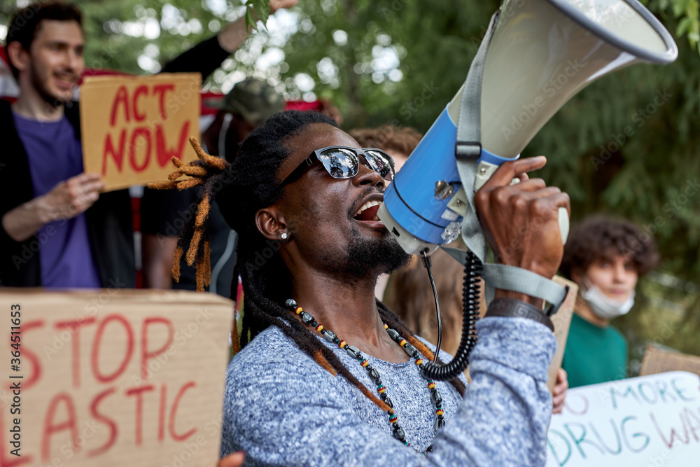 young diverse people protest with placards and posters on global strike ...