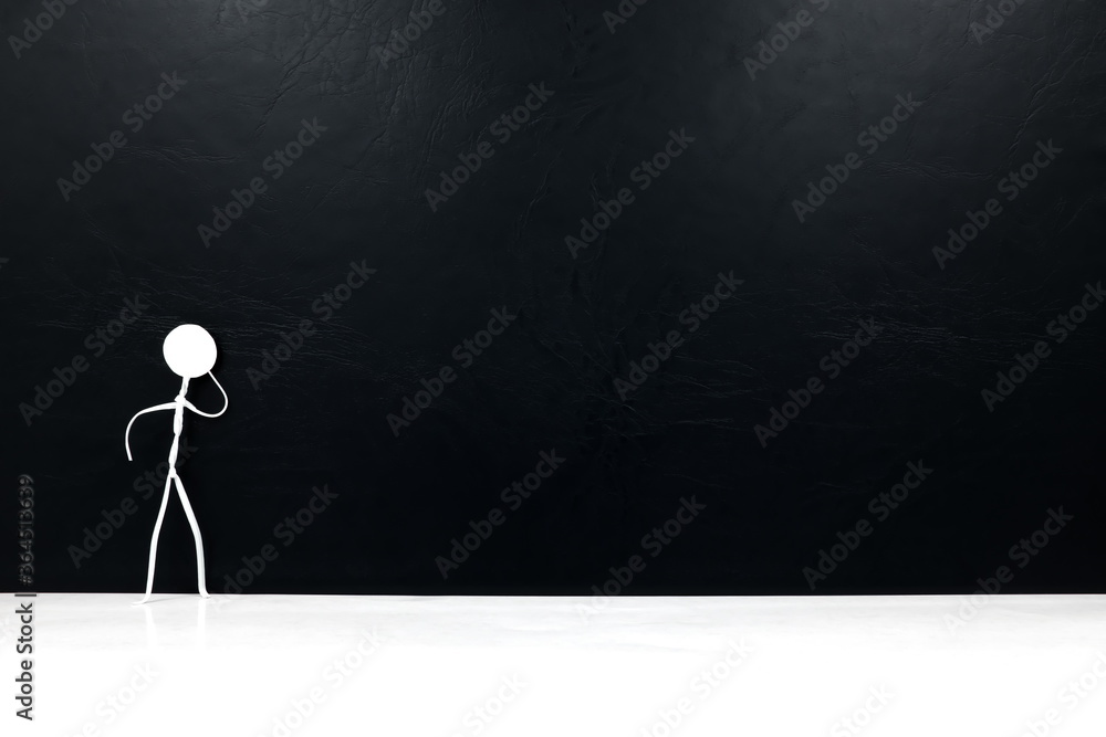 Human stick figure standing alone while thinking in black background ...