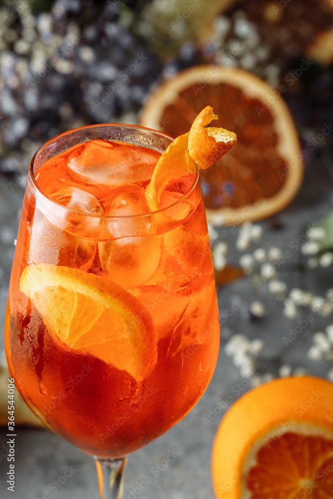 Aperol spritz cocktail on a gray concrete background. a glass of aperol ...