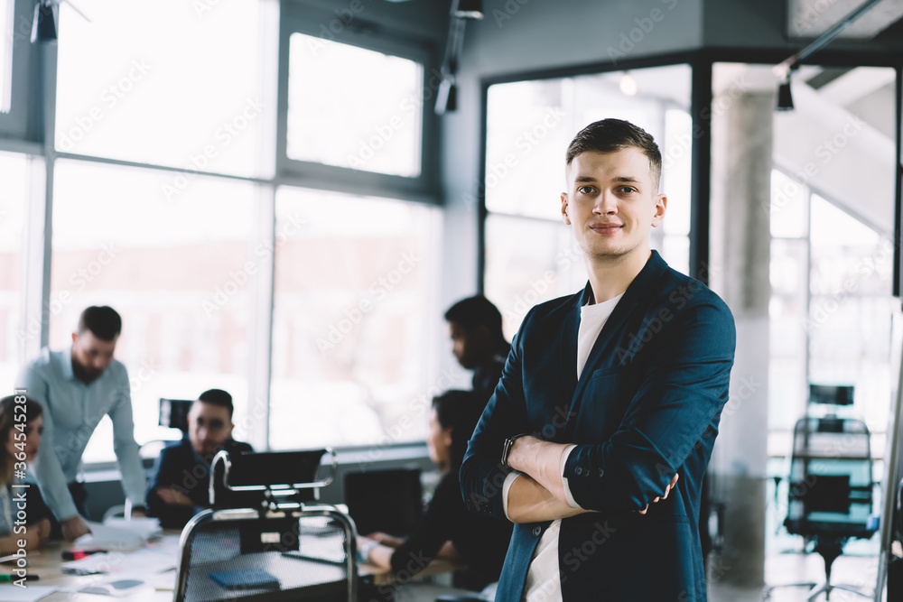 Half length portrait of successful proud ceo with crossed hands looking ...