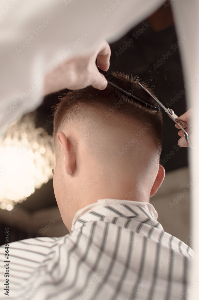 Professional barber styling with scissors and comb, Men's hairstyling ...