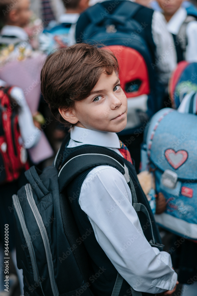 A young boy elementary school student goes to study. Ceremonial first ...