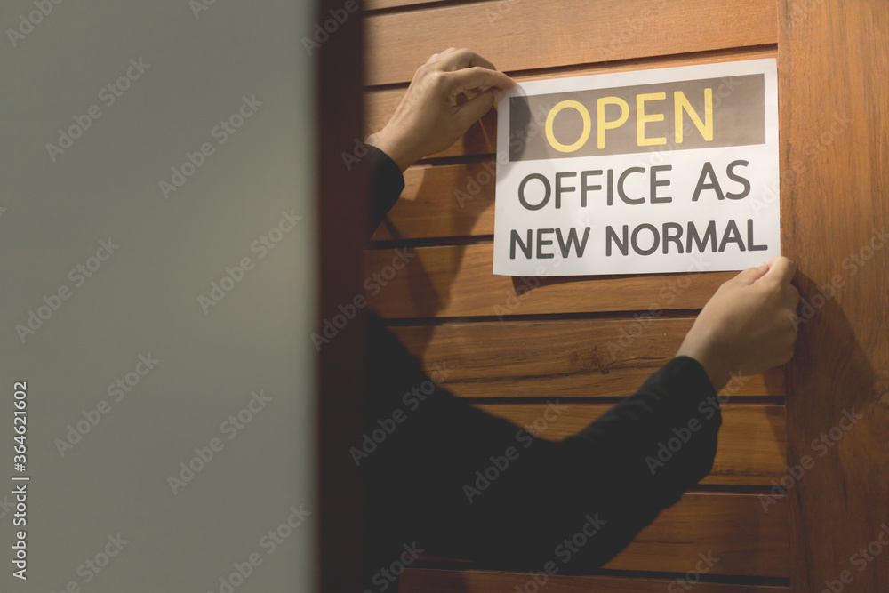 Business owner wears masks to label for open office. The concept is ...