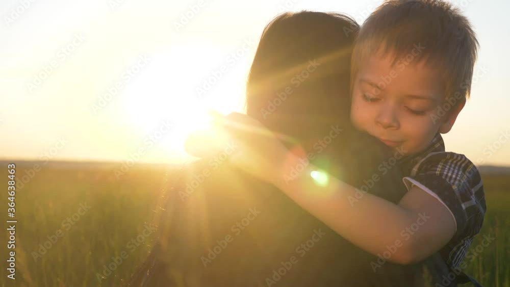 son hugs mom. concept happy family teamwork. boy kid hugs beloved ...