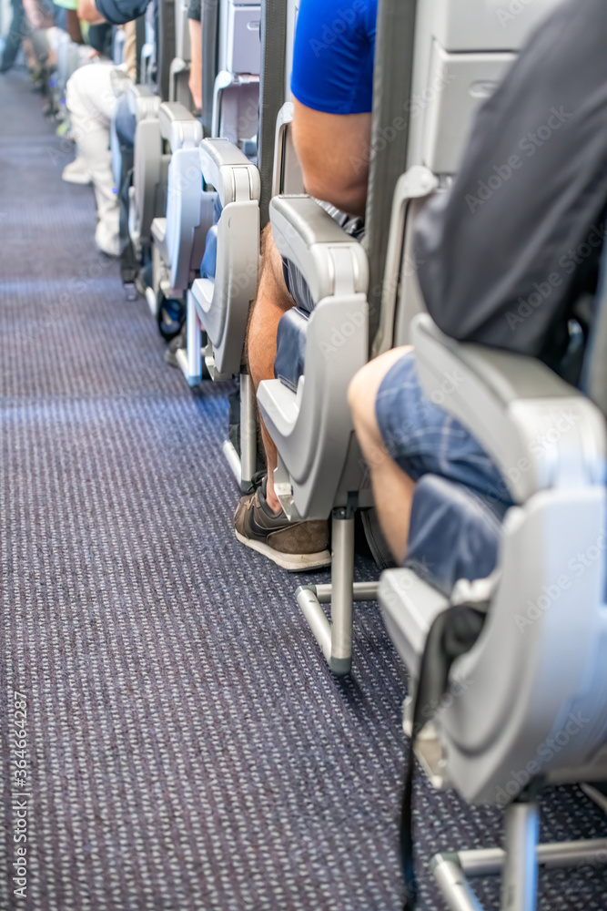 Back view of airplane aisle and seats during flight Stock Photo | Adobe ...
