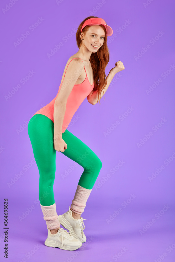 ginger girl doing warm up exercises, wants to have muscular arms and ...