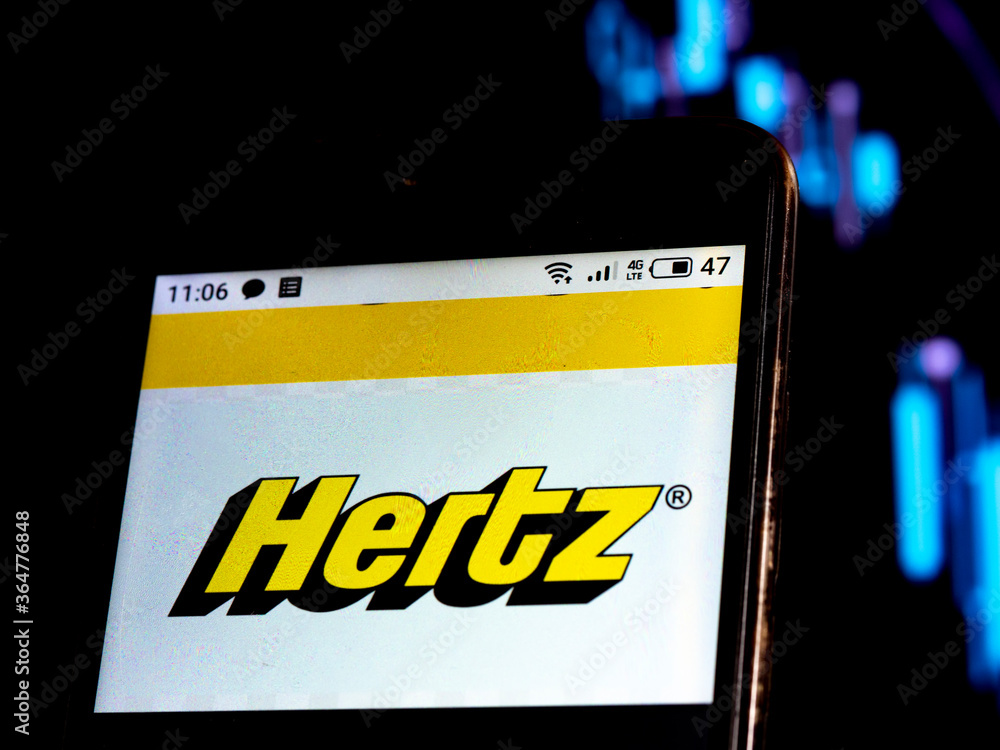 In this photo illustration Hertz logo is seen displayed on a smartphone ...