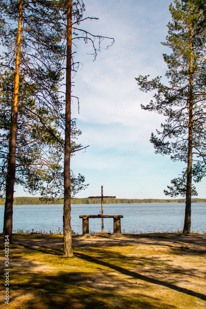 Outdoor wooden altar on the edge of the lake and the forest. Perfect ...