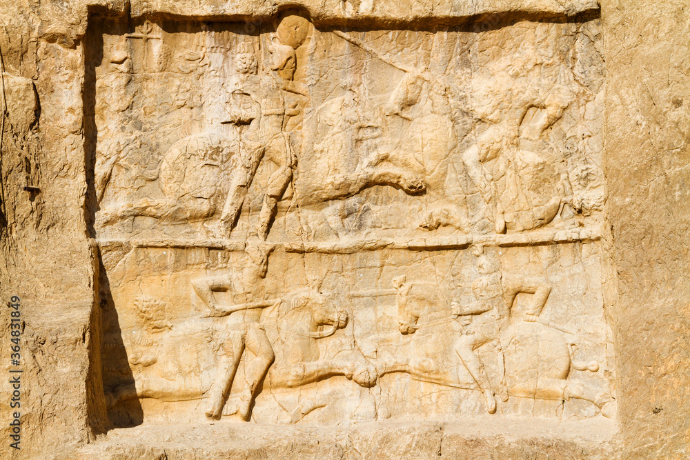 Ancient relief of the necropolis Naqsh-e Rustam that shows the triumph ...