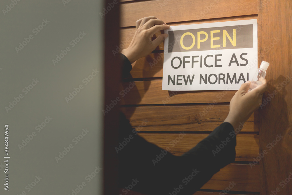 Business owner wears masks to label for open office. The concept is ...