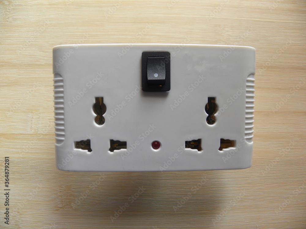 Small white color 3 pin wireless surge protector with 2 sockets, switch ...