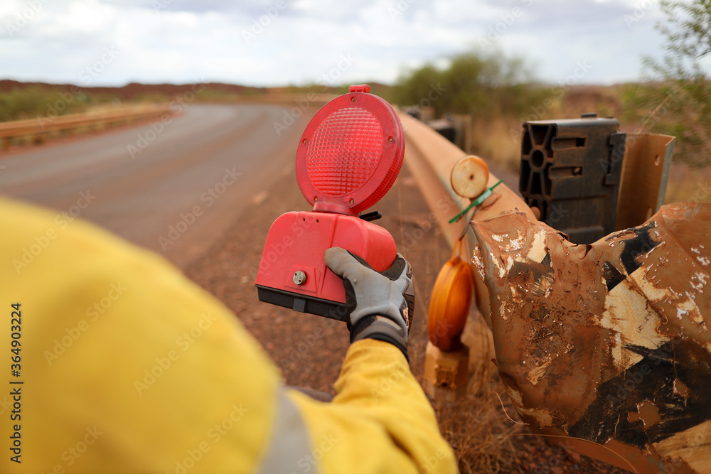 Trained competent road traffic authorize person wearing safety glove ...