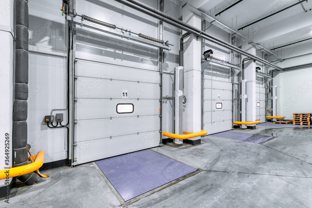 Loading gates of a large industrial warehouse. Industrial interior ...
