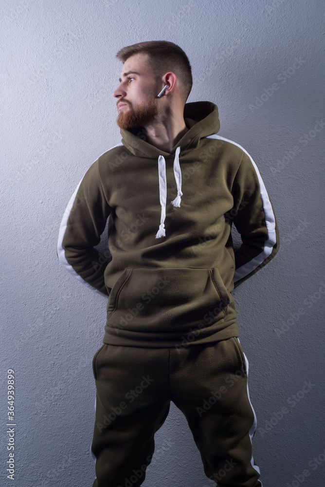 Studio portrait of a young bearded guy of twenty-five years old. in a ...