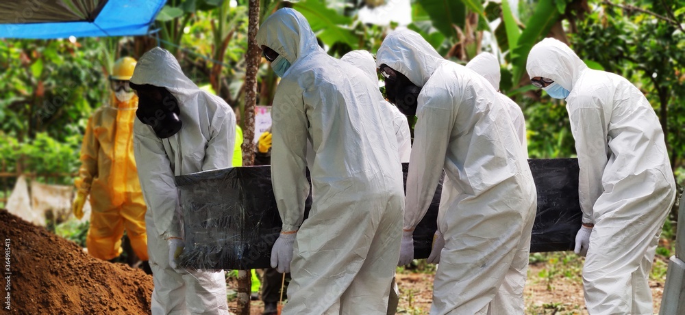 The funeral process of a corpse infected with the corona virus with the ...