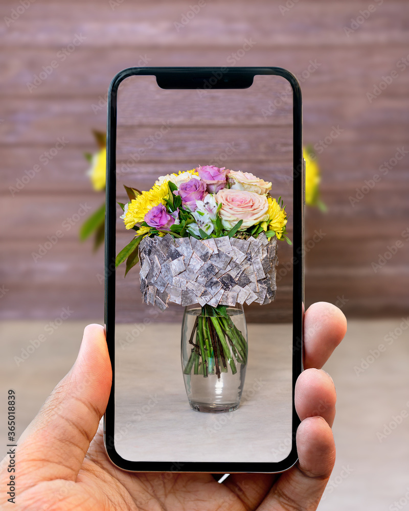 Taking photo of flower bouquet in the vase with mobile phone Stock ...