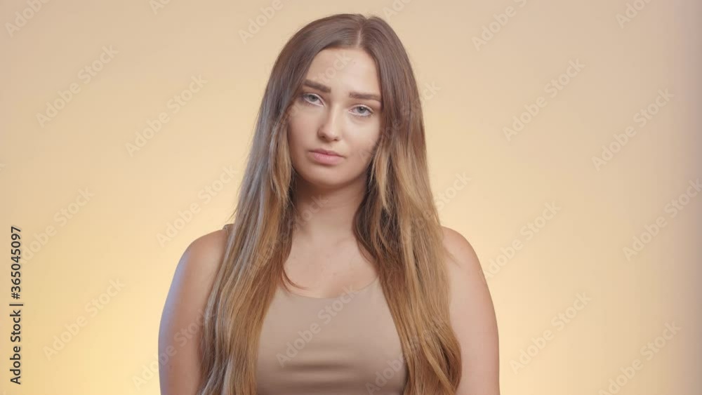 girl listens with a mock deception, female emotions of contempt and ...