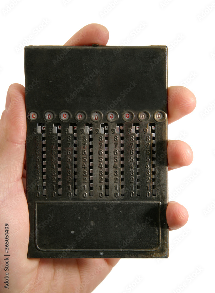 Mechanical calculator in male hand isolated on white. Calculator is ...