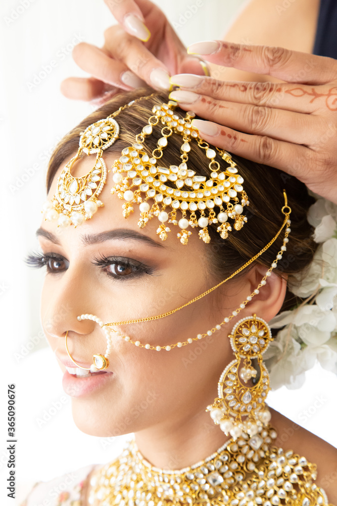 Beautiful female model wearing traditional Sikh wedding attire as she ...