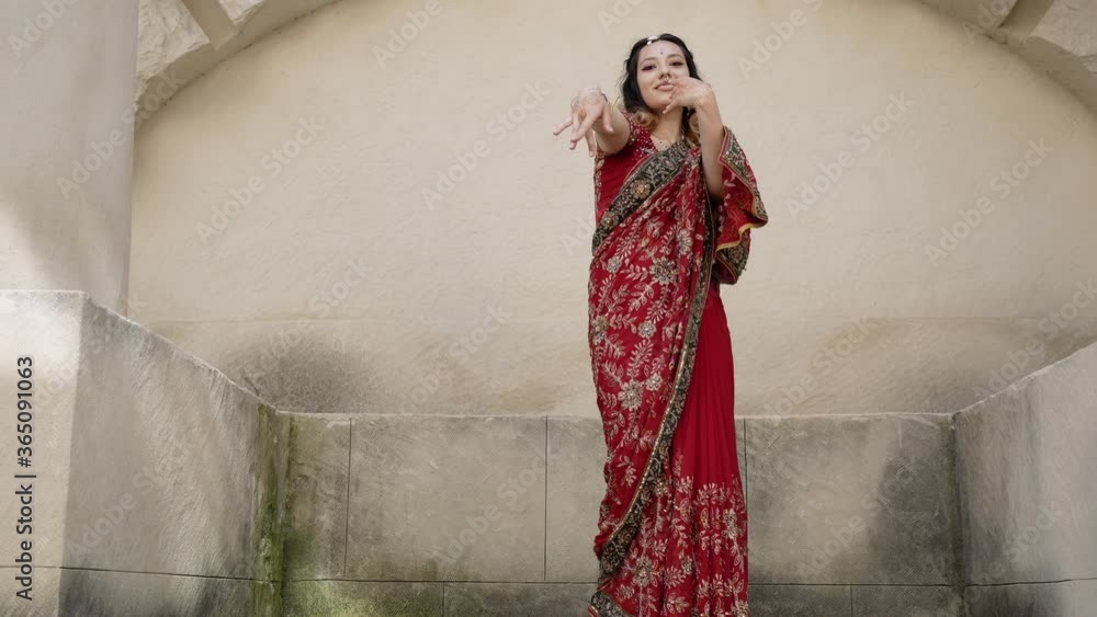 Indian woman dance on streets of ancient architecture city of India ...
