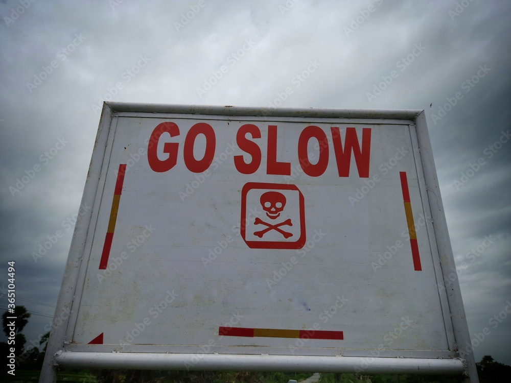 Go slow sign board. Danger symbol board. Go slow white sign board ...