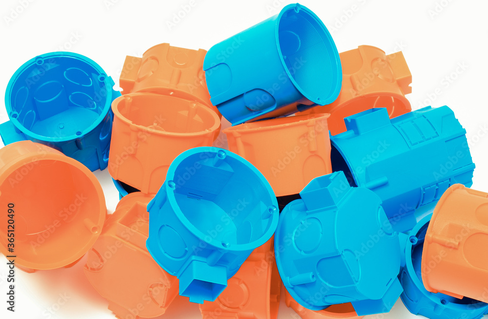 Orange and blue electrical boxes. Components using in electrical ...