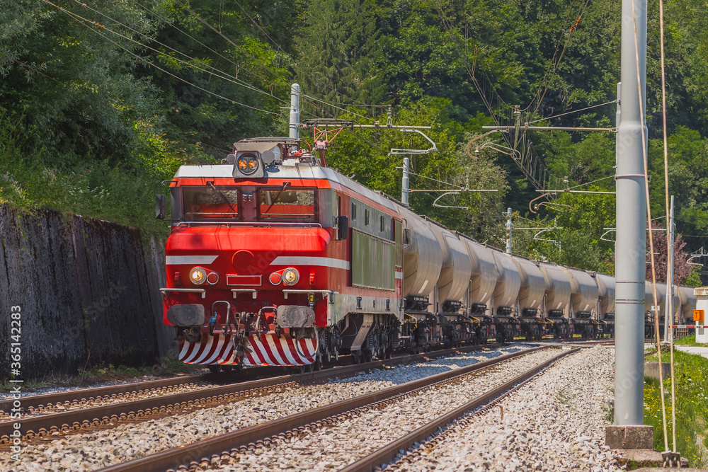 Train hauling waggons with cement. Freight train with a long series of ...