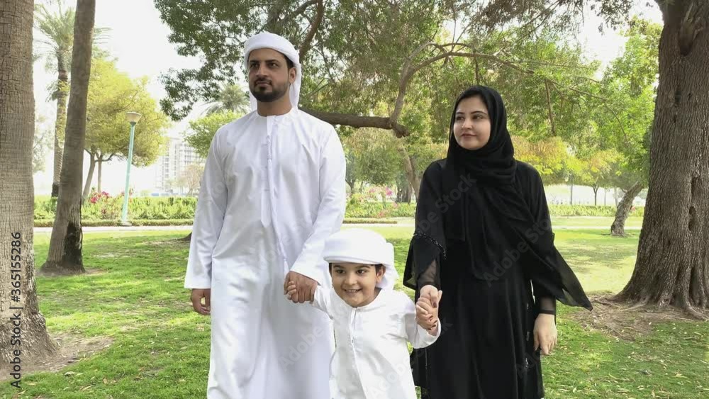 Emirati Family walking forward towards 4K camera. Arab father, mother ...