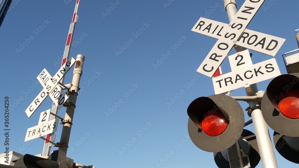 Level crossing warning signal in USA. Crossbuck notice and red traffic ...