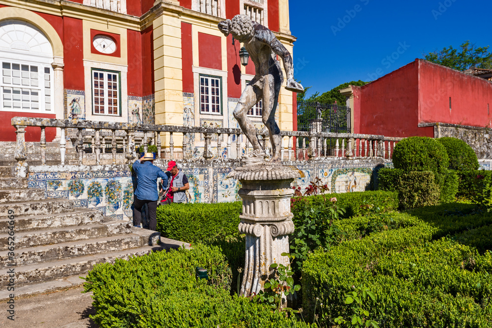 garden, statue and detail of mythological azulejos on the walls of The ...