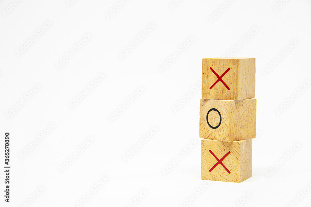 Three layer of wooden square block with O and X character symbol ...