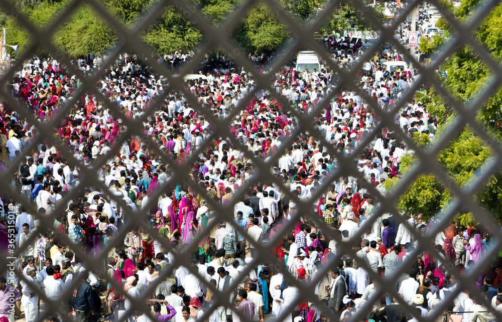 Huge crowd of devotees visible from the window in the grand temple of ...