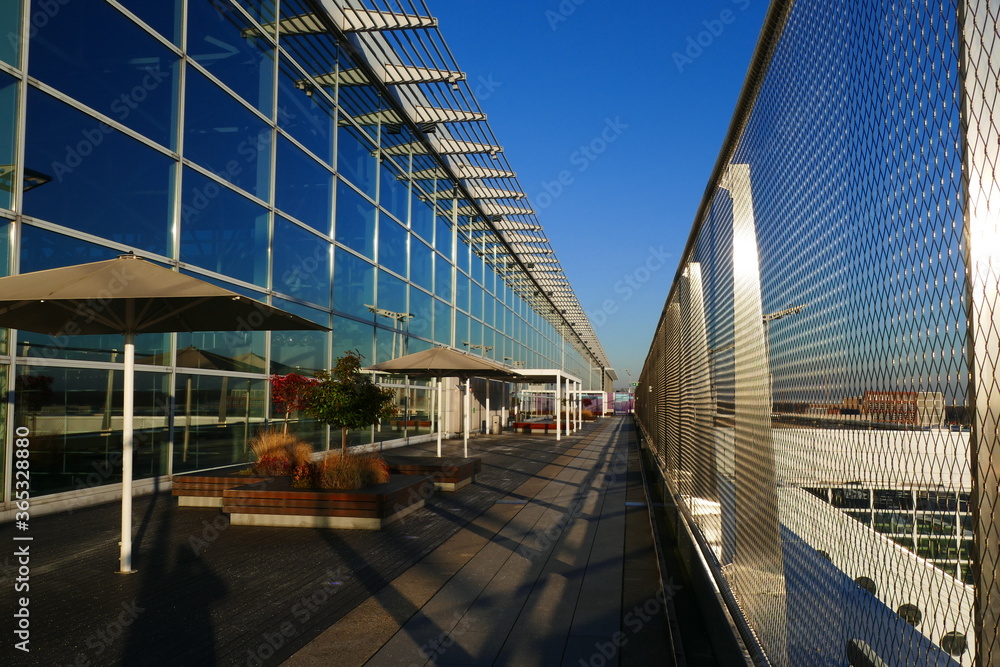 Terrace with modern architecture, security wire nets under blue sky and ...
